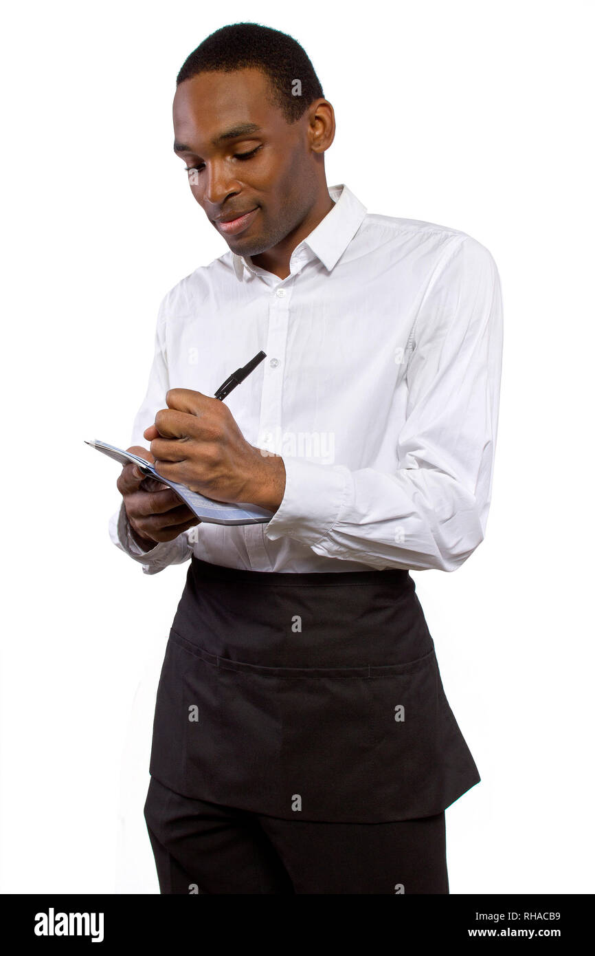 young African-American waiter wearing an apron on white background ...