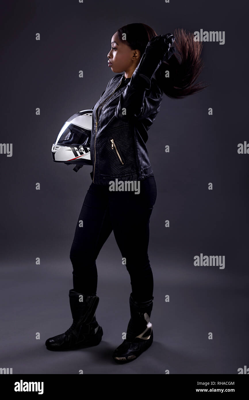 Black female motorcycle biker or race car driver or stuntwoman wearing ...