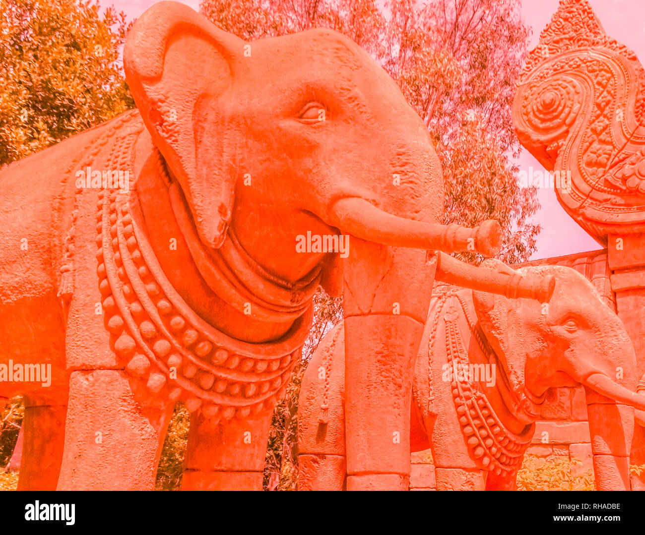 stone elephants, sculptures at the entrance to the Park in coral color ...