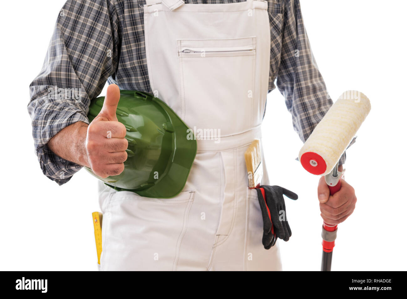 House painter worker in white work overalls with thumb up, holds in his ...
