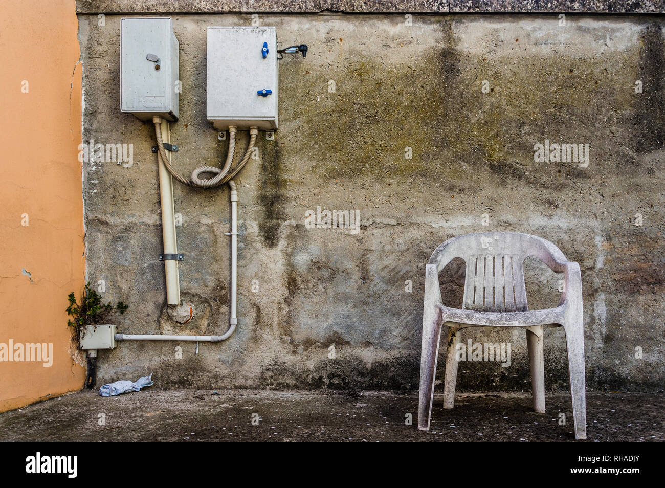 Abandoned old plastic empty chair, conceptual photo Stock Photo - Alamy