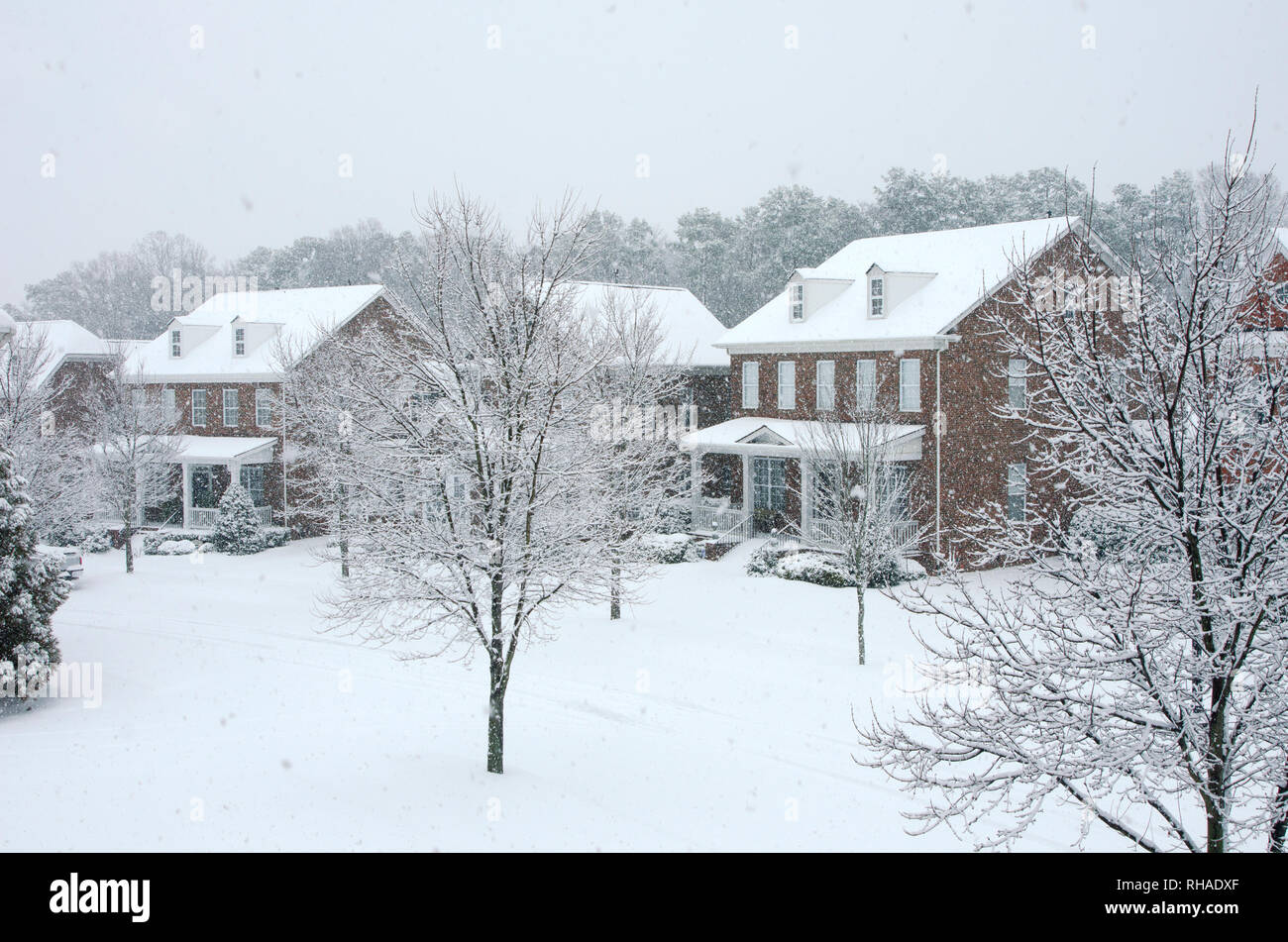 Traditional Brick Homes in a Neighborhood Covered in Snow After a Storm ...