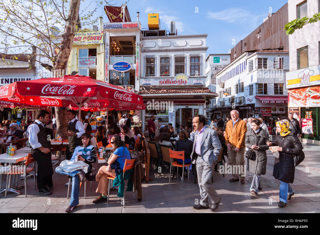 Istanbul, Turkey : People sit at outdoors cafes at Divan Yolu street ...