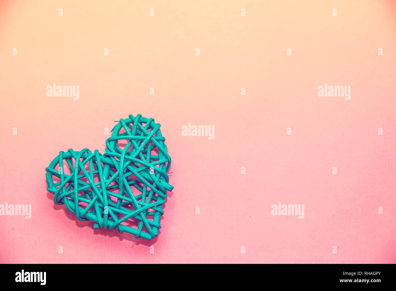 Heart of rattan on a pink background. Valentine's Day. Holiday ...