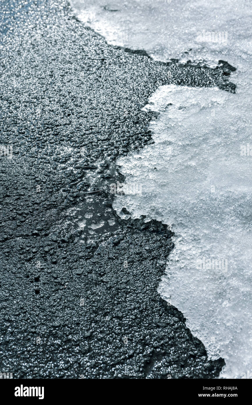 melting snow on edge of asphalt road in spring season Stock Photo - Alamy