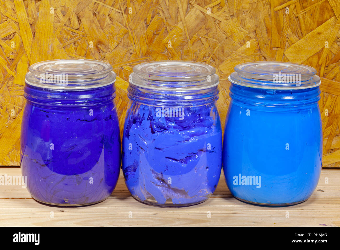colorful blue tone paint in glass bottles. ink of screen printing for ...