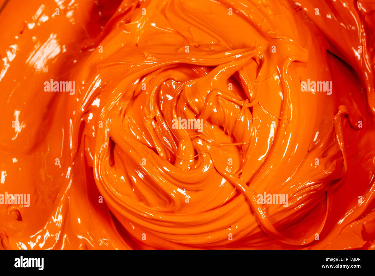 close up orange color of oil paint.ink of screen printing for print on ...