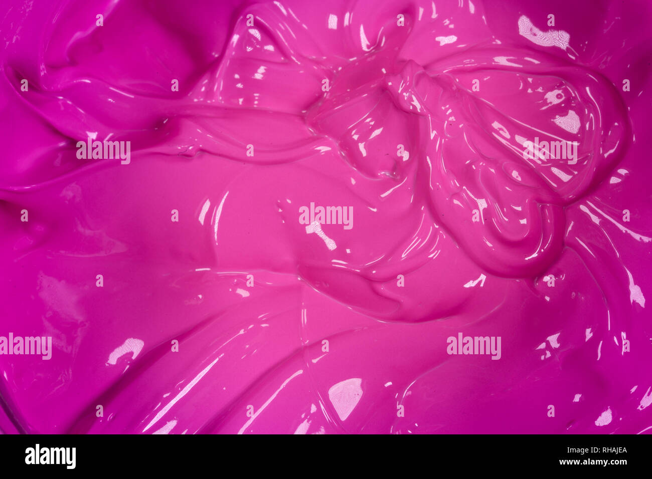 close up pink color of oil paint. ink of screen printing for print on ...