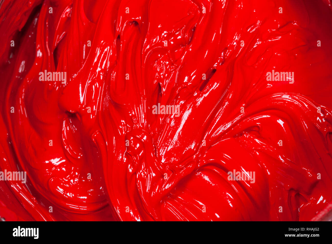 close up red color of oil paint. ink of screen printing for print on ...