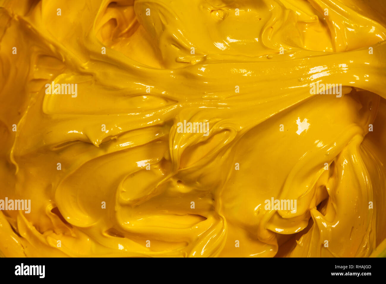 close up yellow color of oil paint. ink of screen printing for print on ...