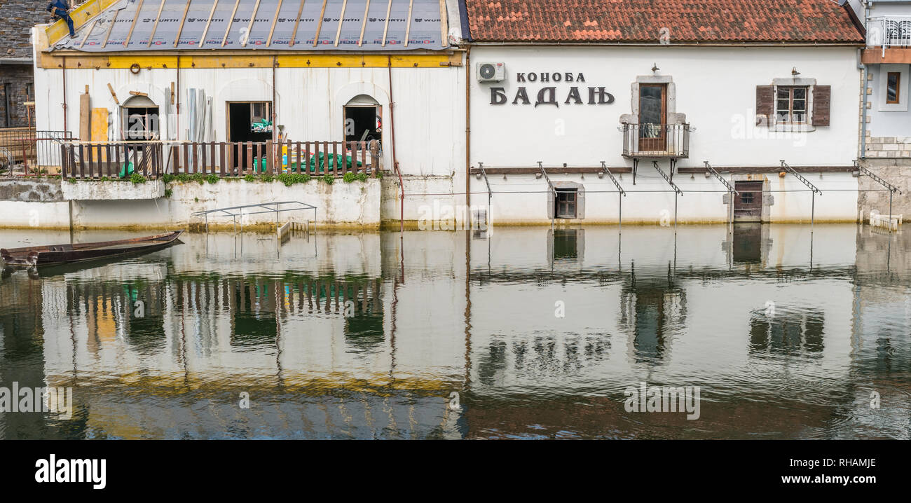 Virpazar, Montenegro - April 2018 : Old buildings reflected in the lake ...