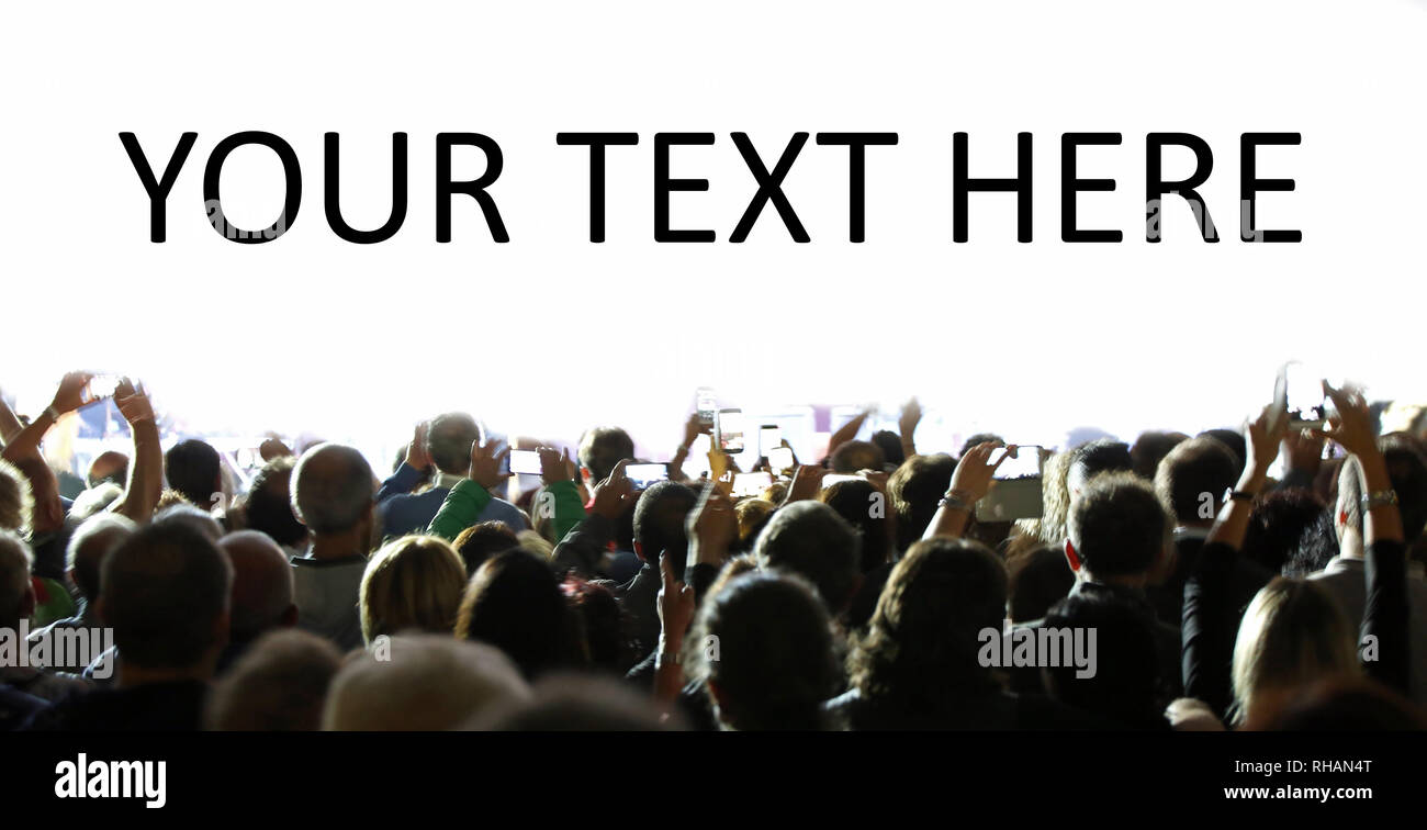 many people with smartphone during an event and customizable text on a ...