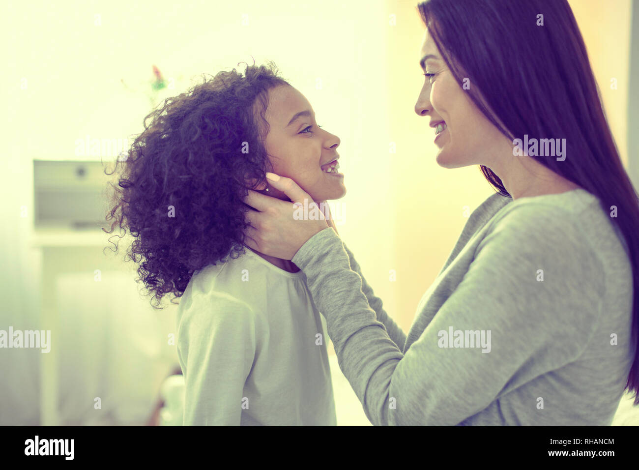 Nurturing mother admiring her healthy beautiful daughter Stock Photo ...