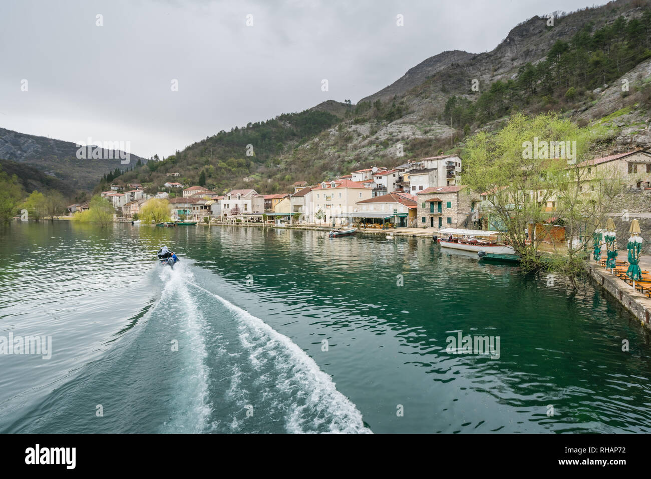 Rijeka Crnojevica, Montenegro - April 2018 : Speedboat going through the Rijeka Crnojevica on a ...