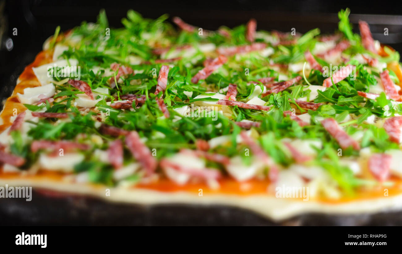 Process of making pizza. Italian pepperoni pizza with mushrooms ...