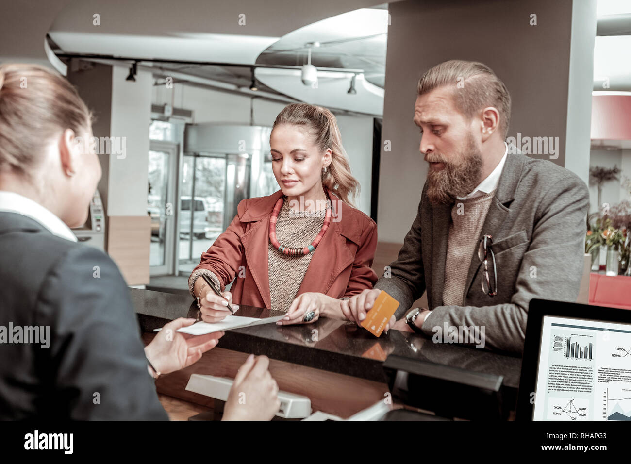 Employee putting up sign hi-res stock photography and images - Alamy