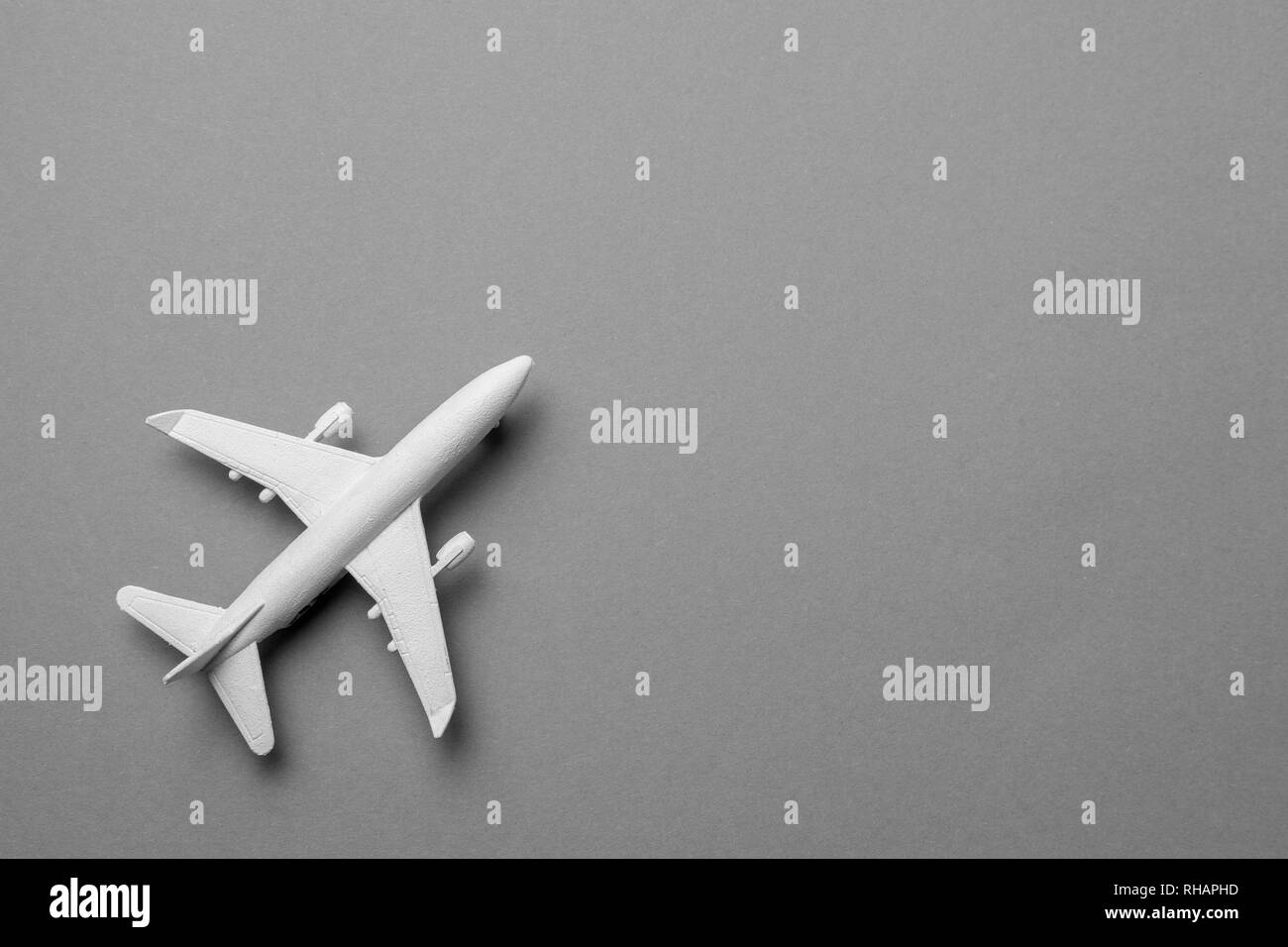 White passenger plane on gray background. Copy space for text Stock ...