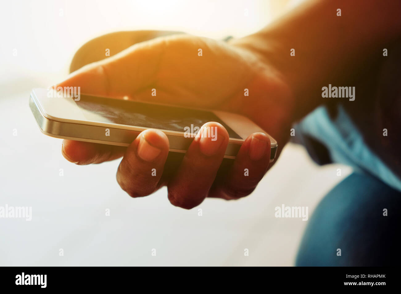 Using smartphone background Stock Photo - Alamy