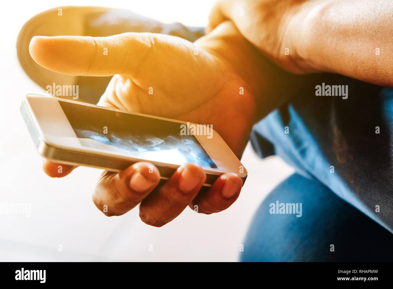 Using smartphone background Stock Photo - Alamy