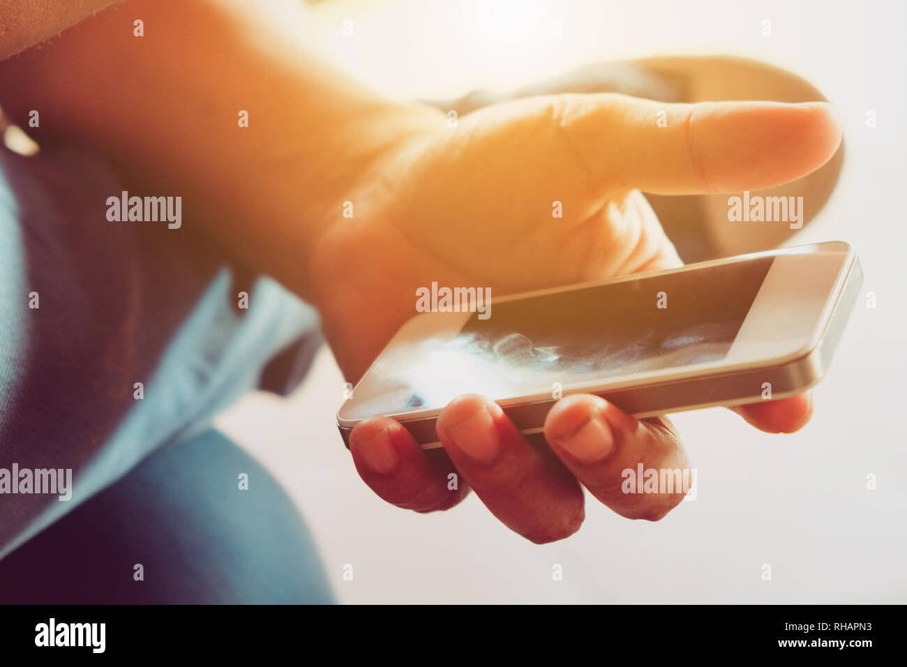 Using smartphone background Stock Photo - Alamy
