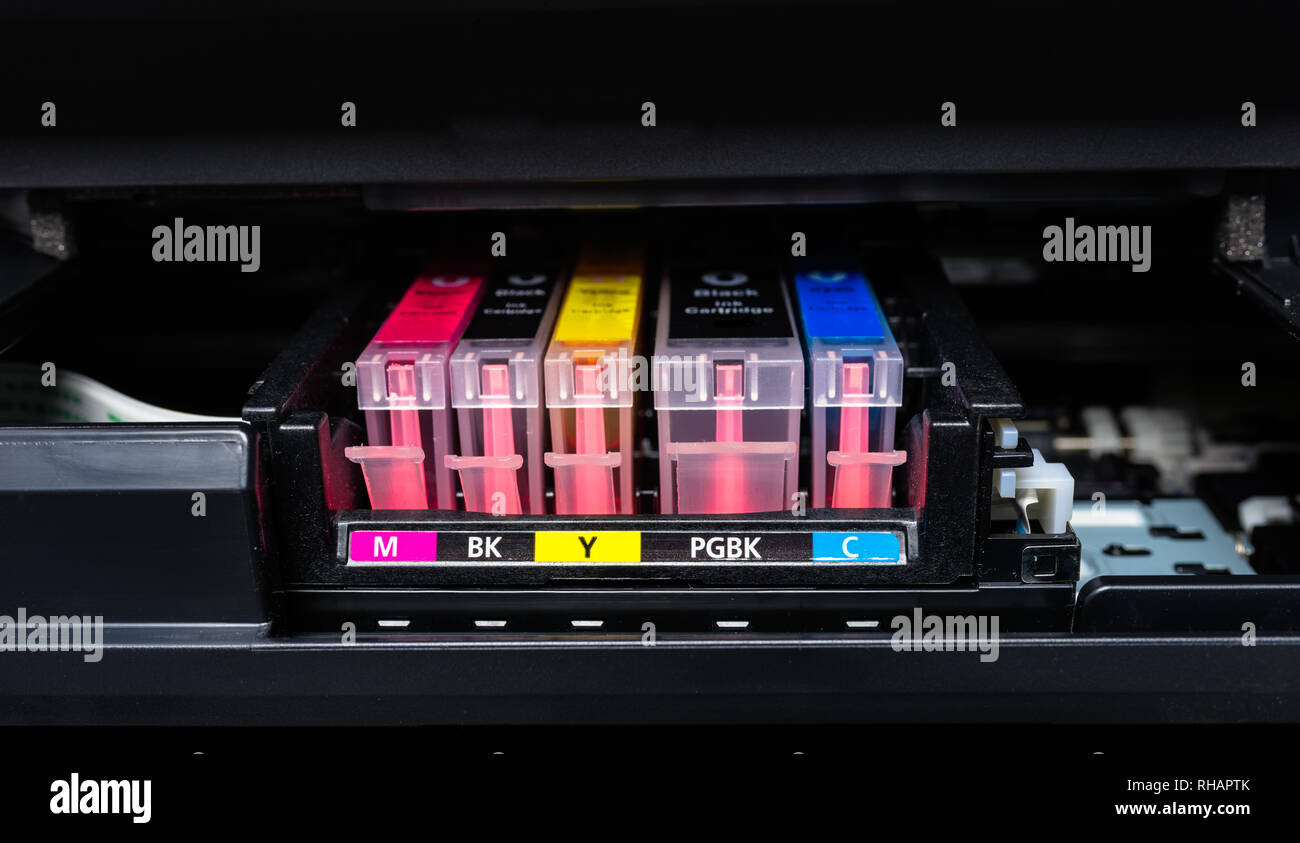 Close-up shot of a CMYK ink cartridges in a color printer Stock Photo ...