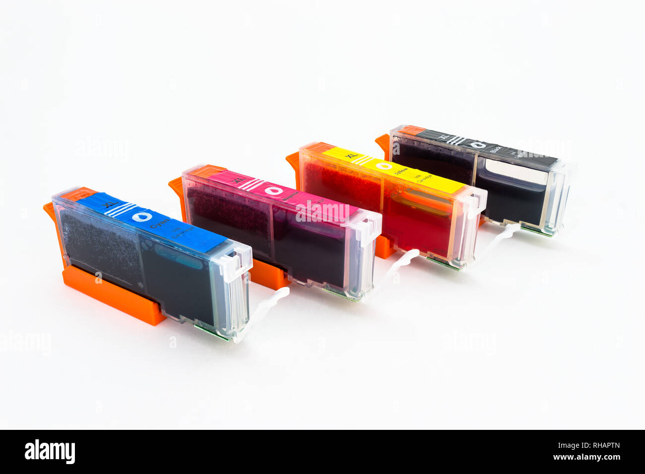 Close-up shot of a CMYK ink cartridges for a color printer isolated on ...