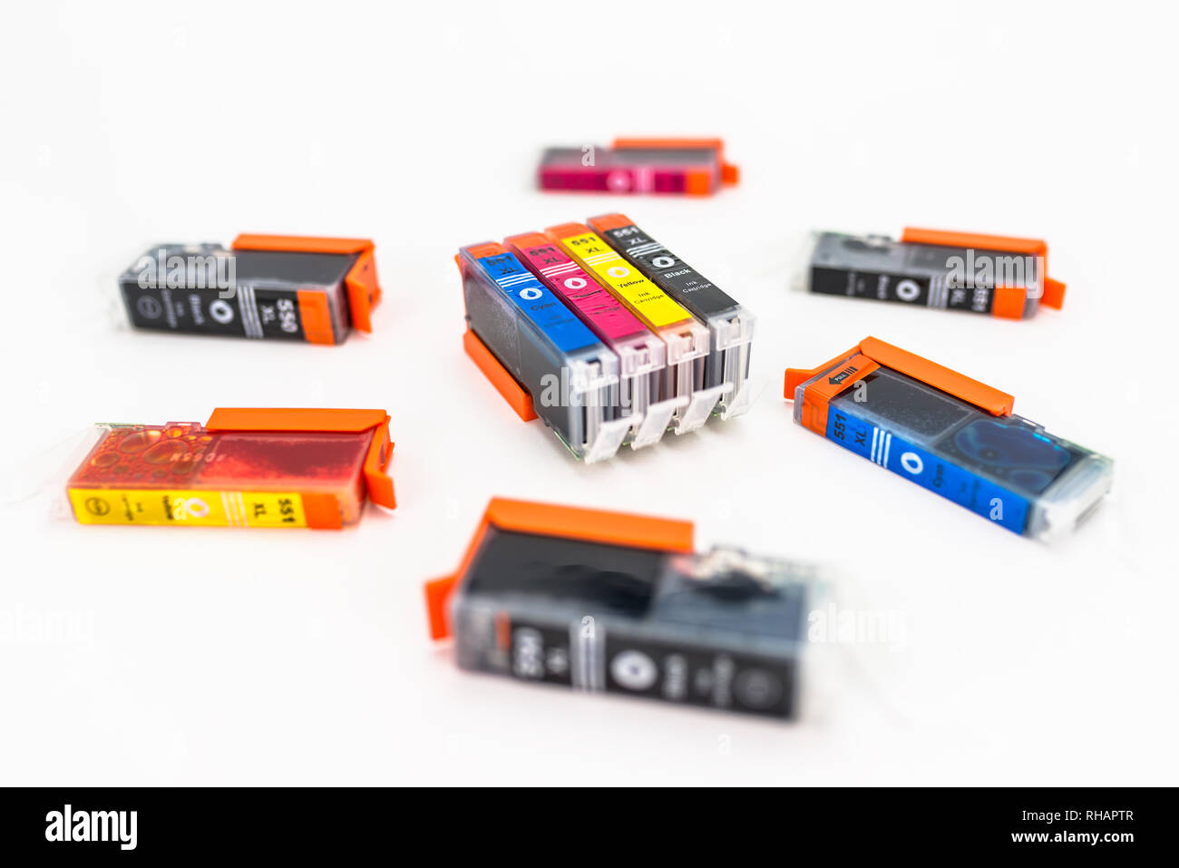 Close-up shot of a CMYK ink cartridges for a color printer isolated on ...