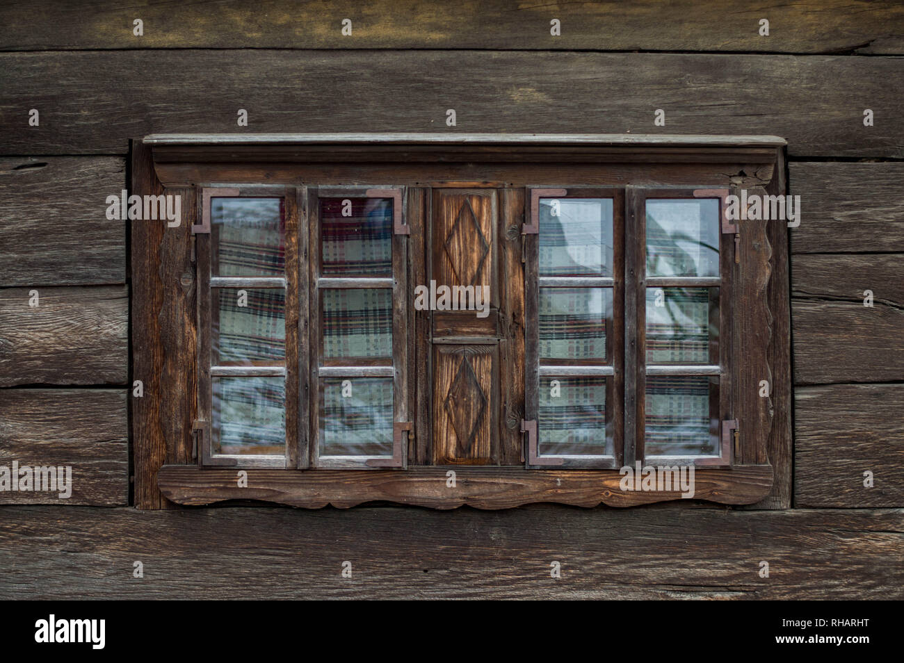 Traditional wooden and stone house with a windows - peasant cabin Stock ...
