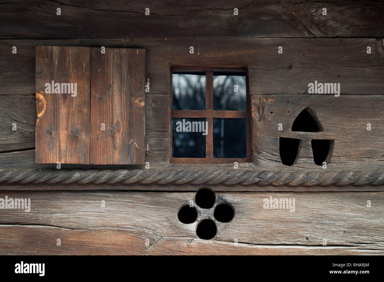 Traditional wooden and stone house with a windows - peasant cabin Stock ...