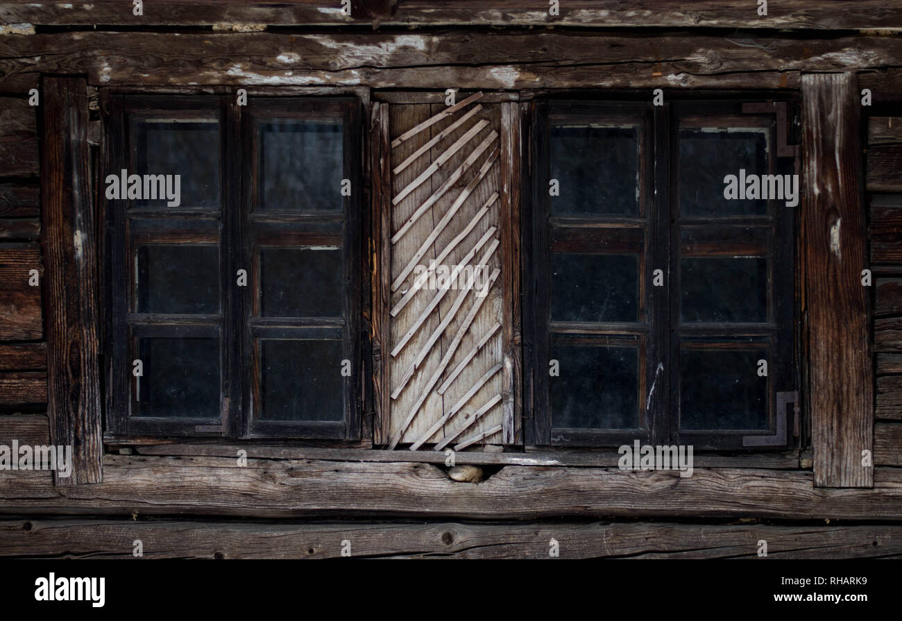 Traditional wooden and stone house with a windows - peasant cabin Stock ...
