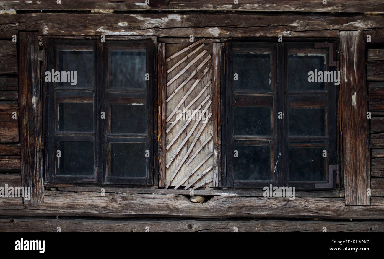 Traditional wooden and stone house with a windows - peasant cabin Stock ...