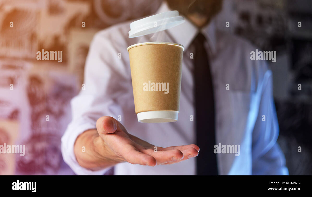 Barista in a white shirt with a tie holds floating in the air a paper ...