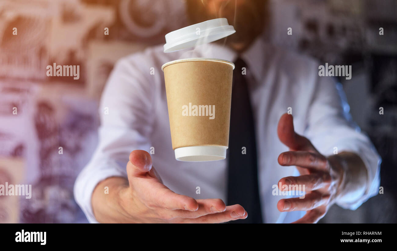 Barista in a white shirt with a tie holds floating in the air a paper ...