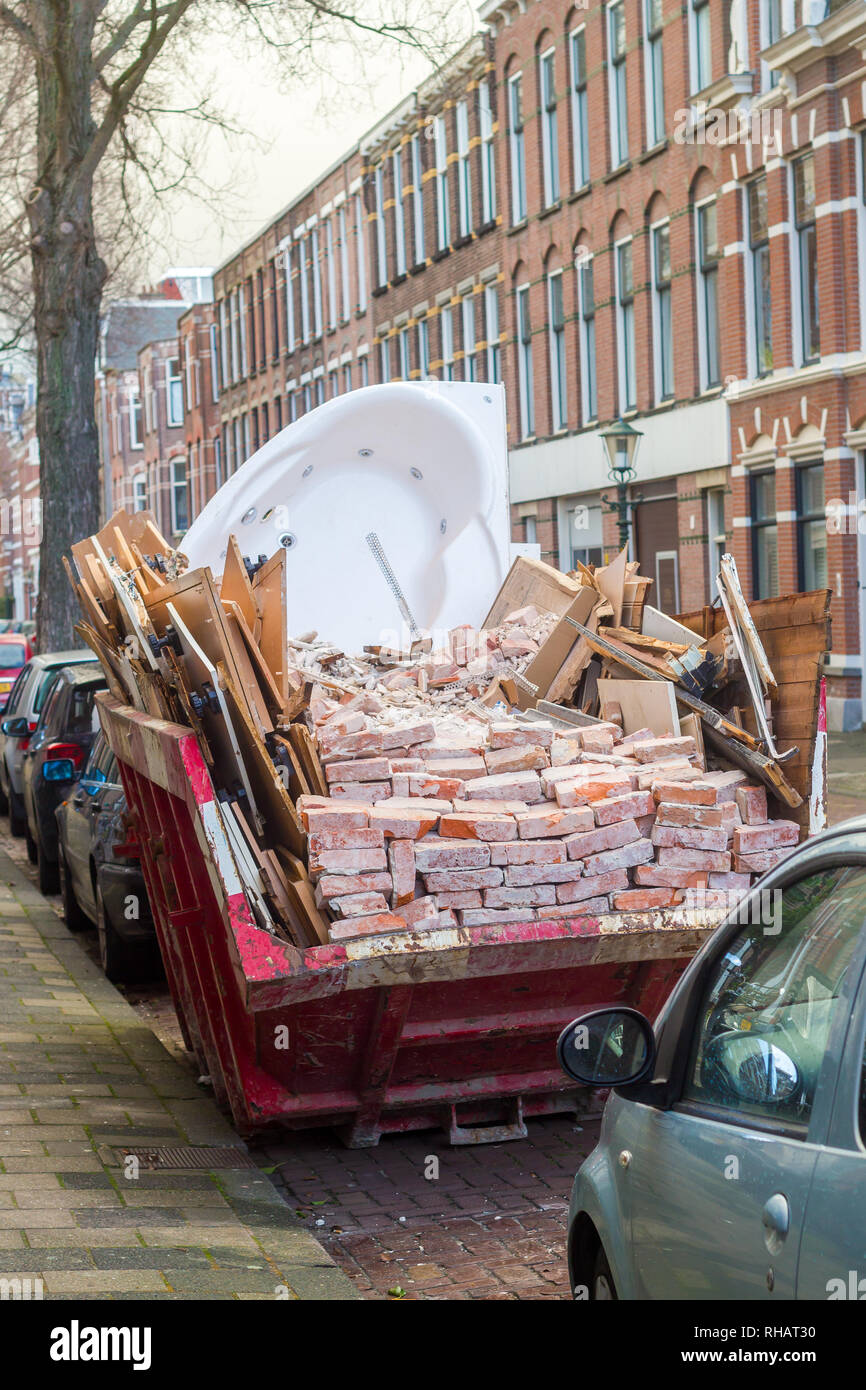 The Hague, the Netherlands - June 28, 2019: rubbish skip full of bricks ...