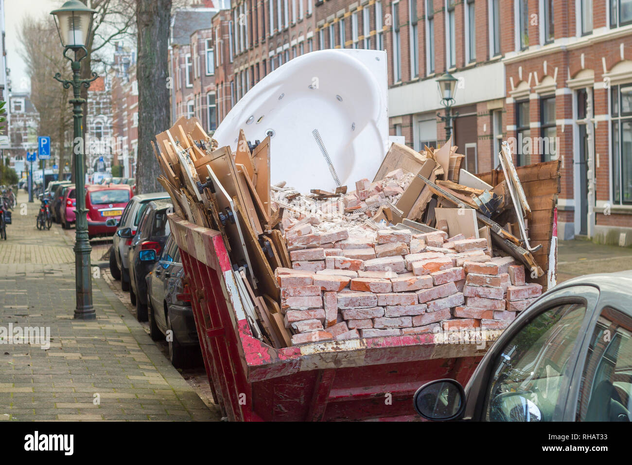 The Hague, the Netherlands - June 28, 2019: rubbish skip full of bricks ...