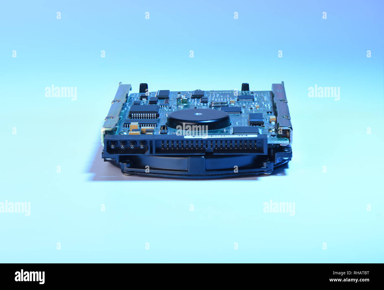 Used hard disk isolated on white background and blue backlight Stock ...