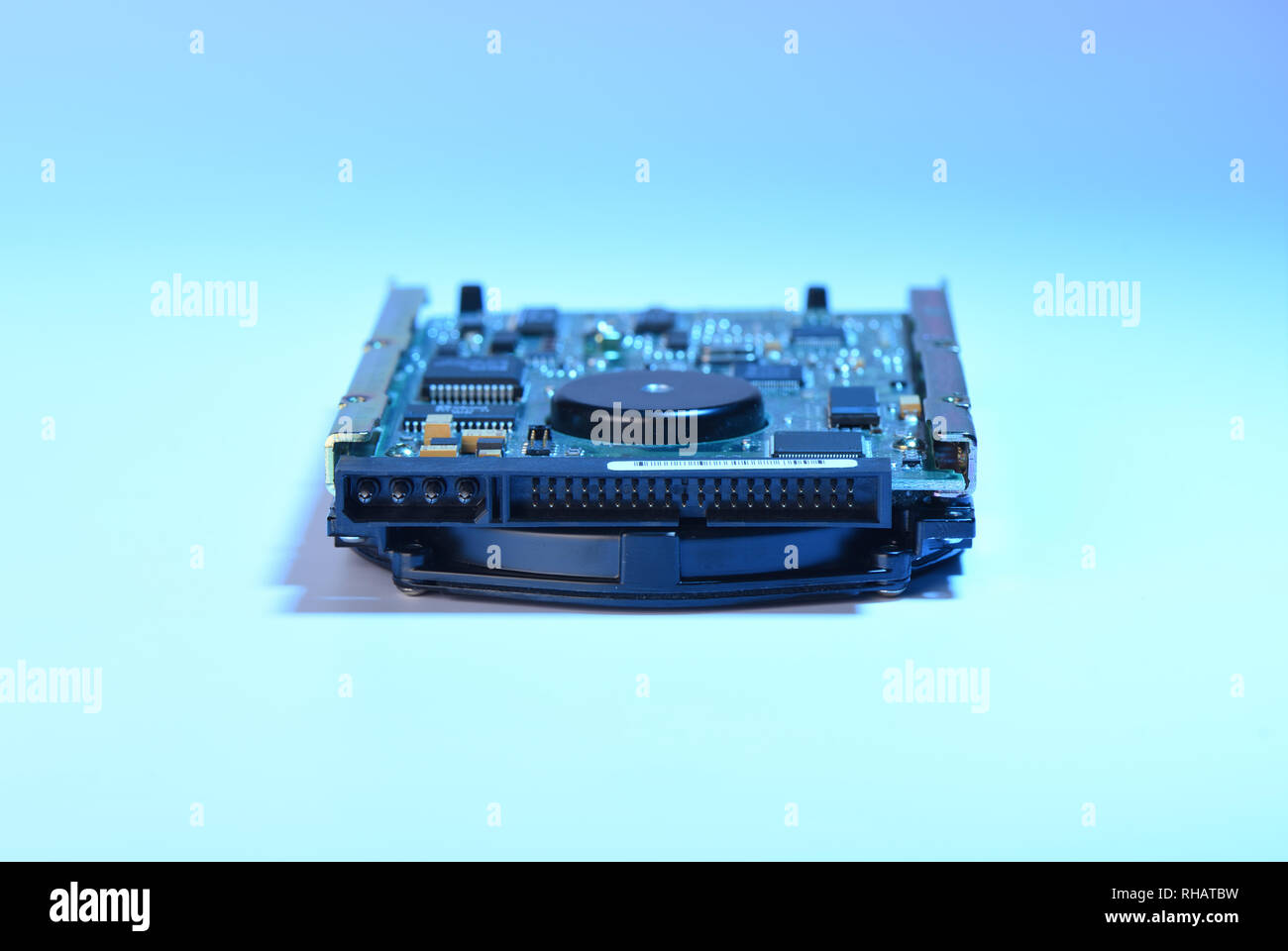 Soft focus. Used hard disk isolated on white background and blue ...