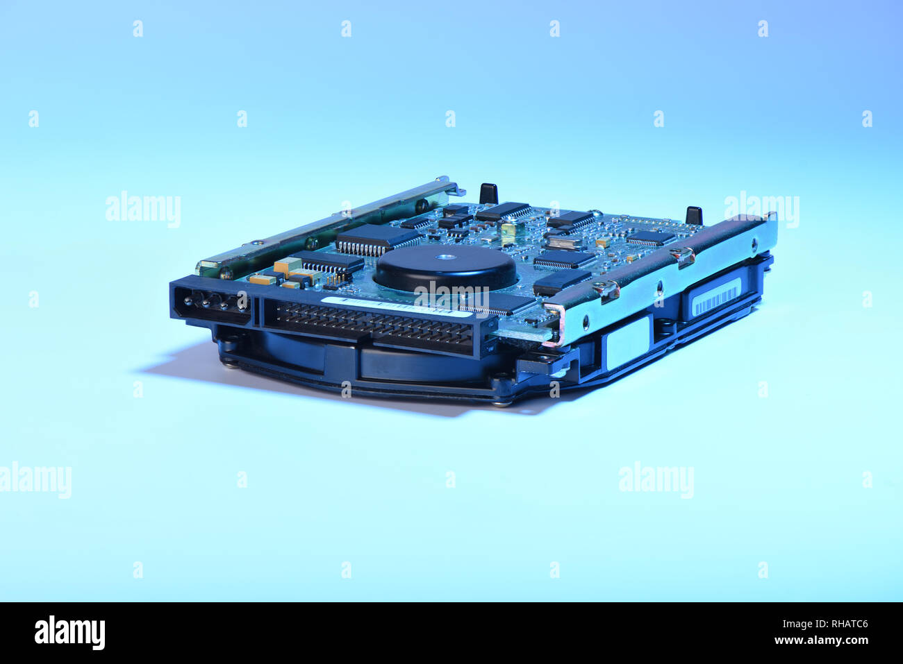 Used hard disk isolated on white background and blue backlight Stock ...