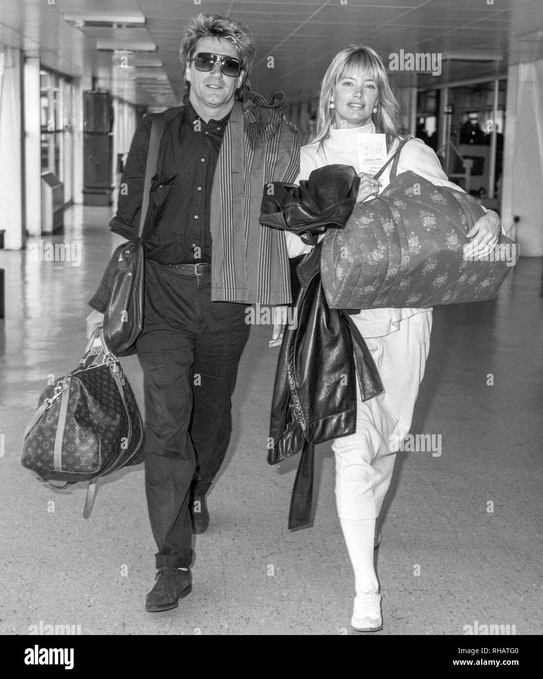 British Rock singer Rod Stewart with girlfriend Kelly Emberg arriving ...