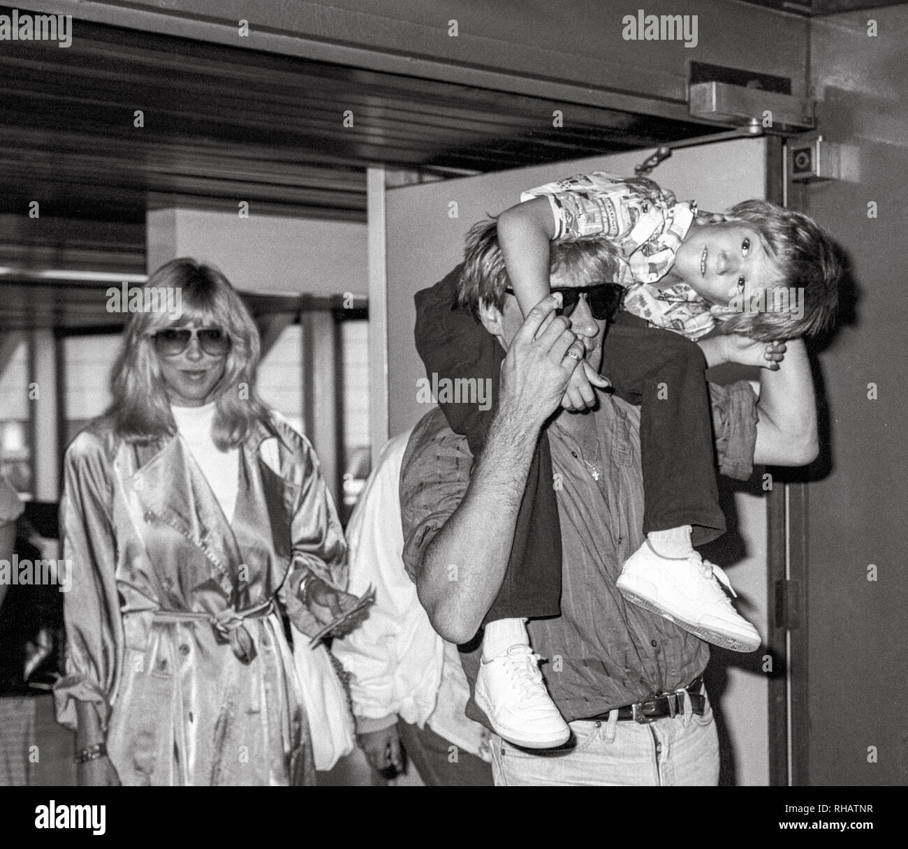 British rock singer Rod Stewart with girlfriend Kelly Emberg and son ...