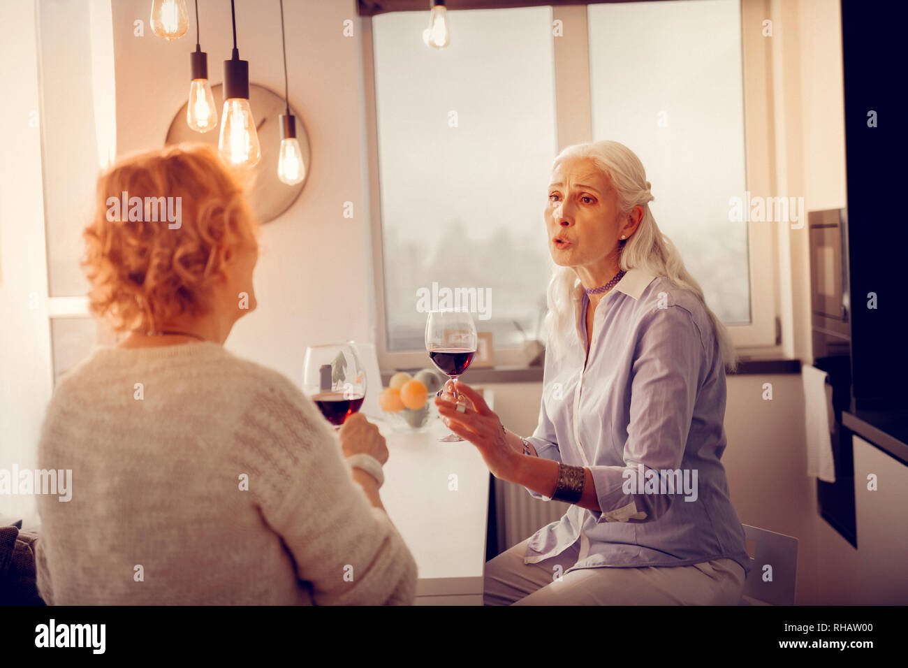 Nice good looking women relaxing at home together Stock Photo - Alamy