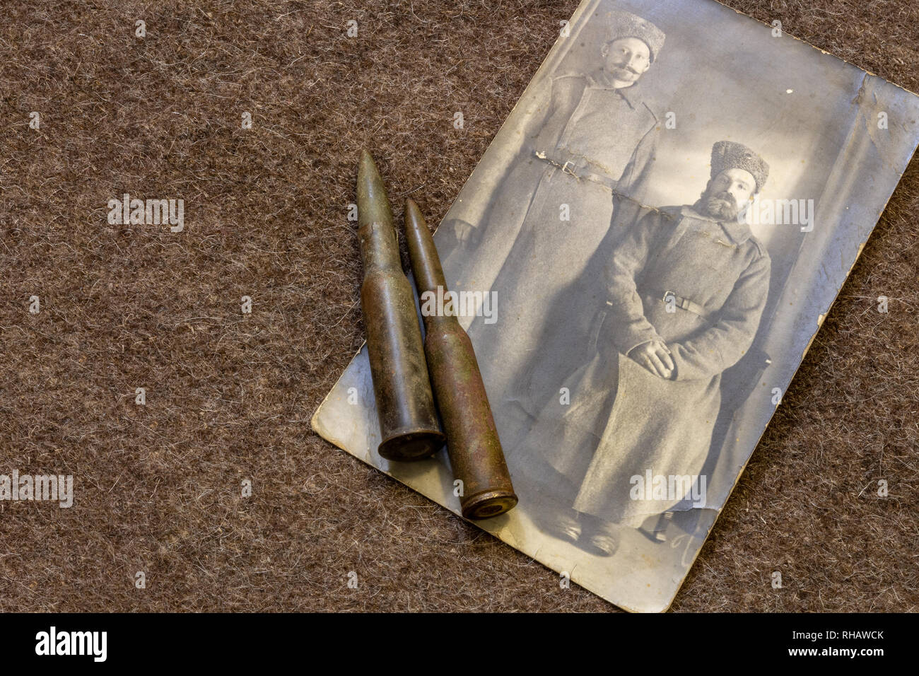 Photo of two soldiers in period of World War I and rifle bullets on ...