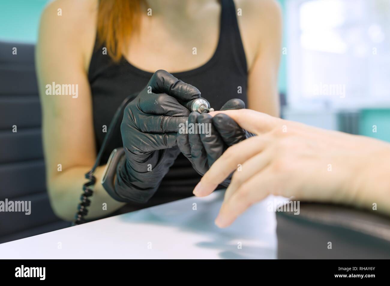 Close-up process of professional manicure, hands of manicurist and ...