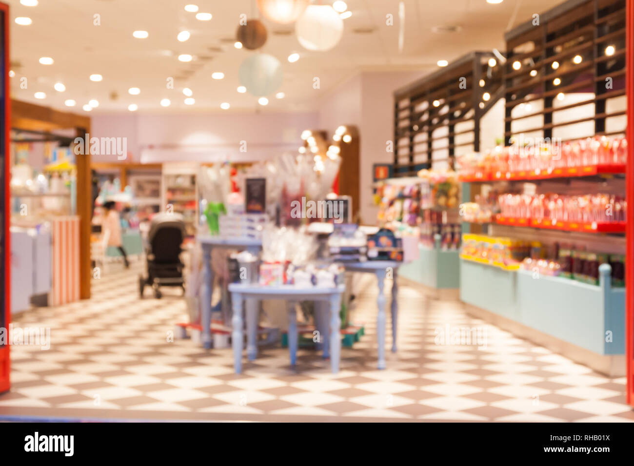 Blurred, colorful and beautiful candy store with people Stock Photo - Alamy