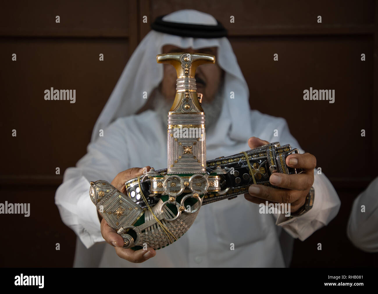 Saudi man holding a janbiya dagger, Najran Province, Najran, Saudi ...