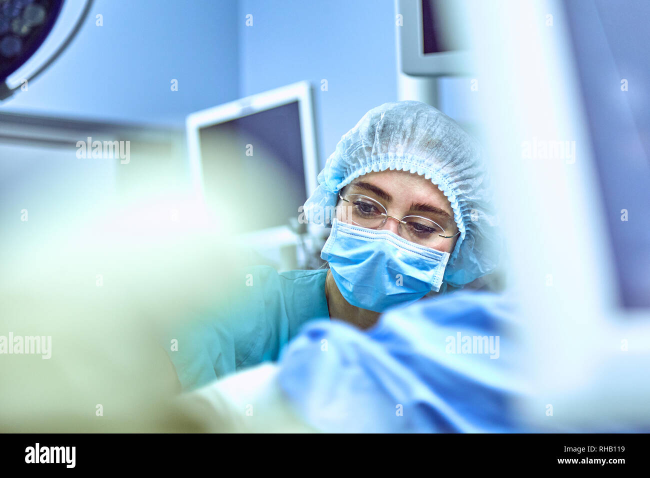 Young Female Surgeon with Medical Team in Back on Surgery Stock Photo ...