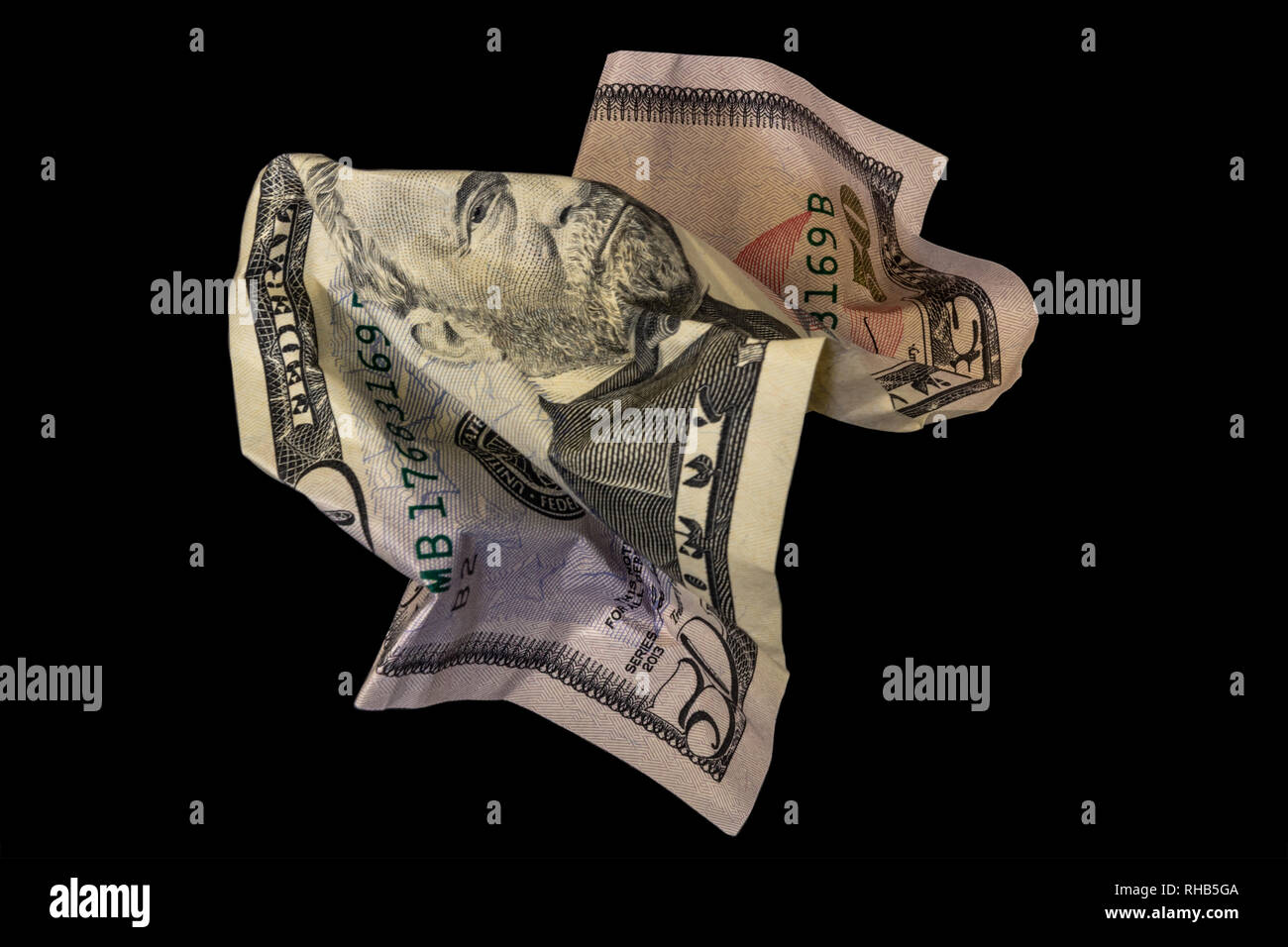 Crumpled fifty dollar bill isolated on black background Stock Photo - Alamy