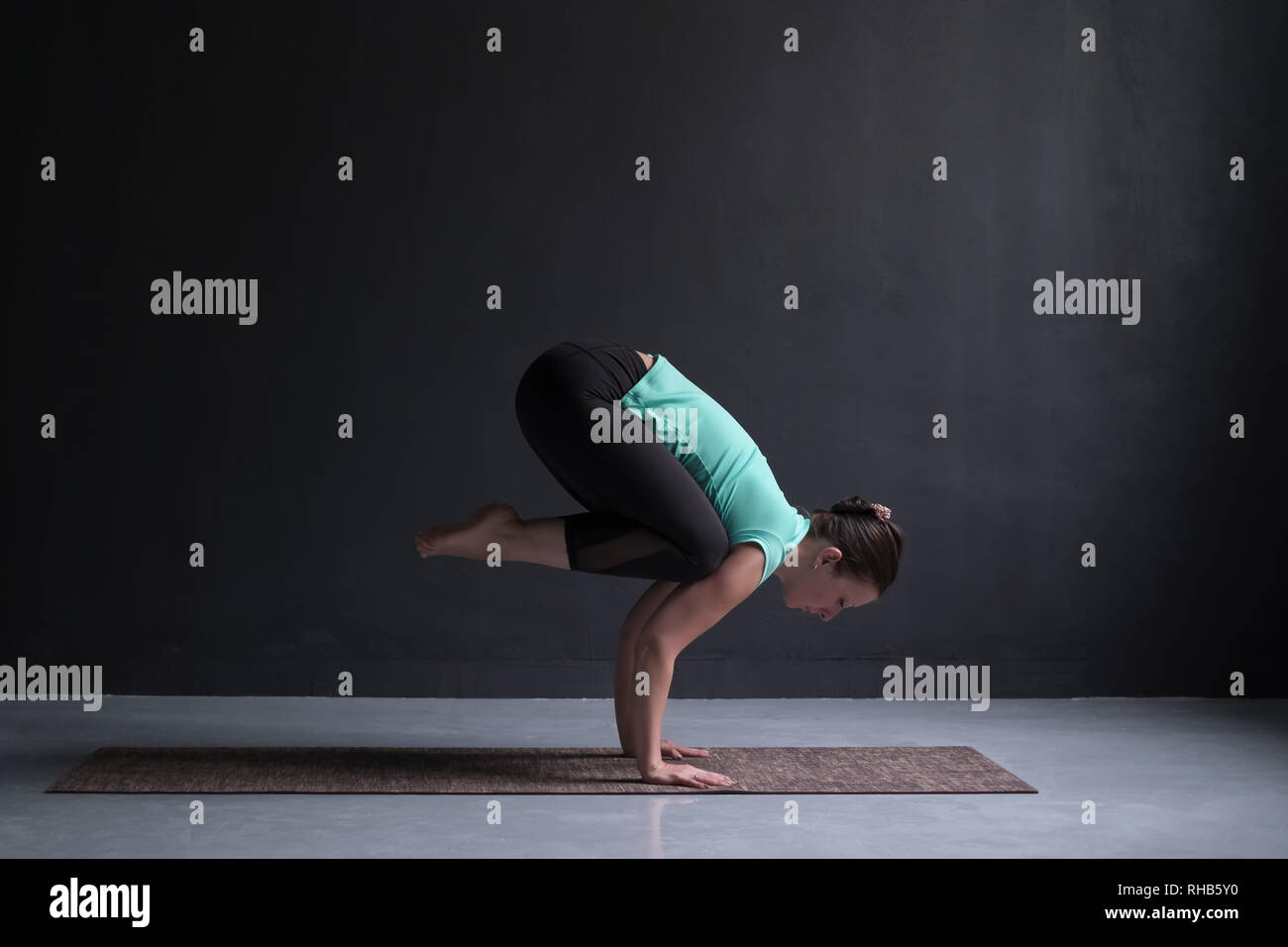Doing crane pose hi-res stock photography and images - Alamy