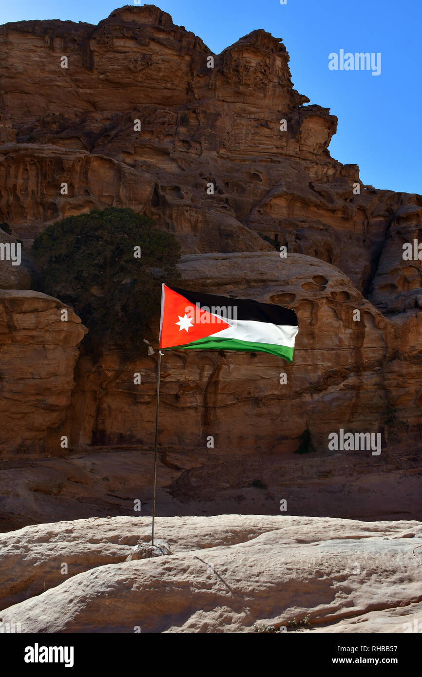 Jordan flag in Petra.The old city of Petra is an UNESCO World Heritage ...