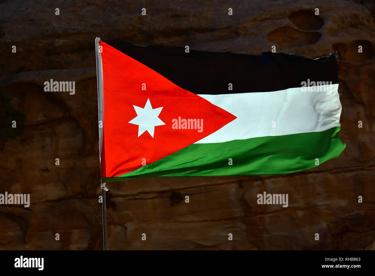 Jordan flag in Petra.The old city of Petra is an UNESCO World Heritage ...